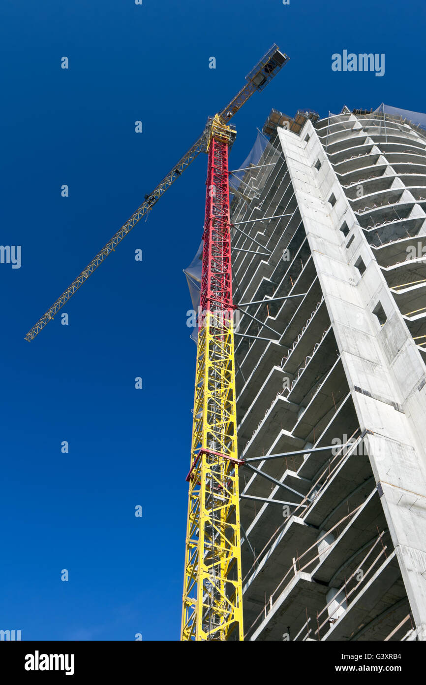 New building construction. Cranes on a construction site Stock Photo ...