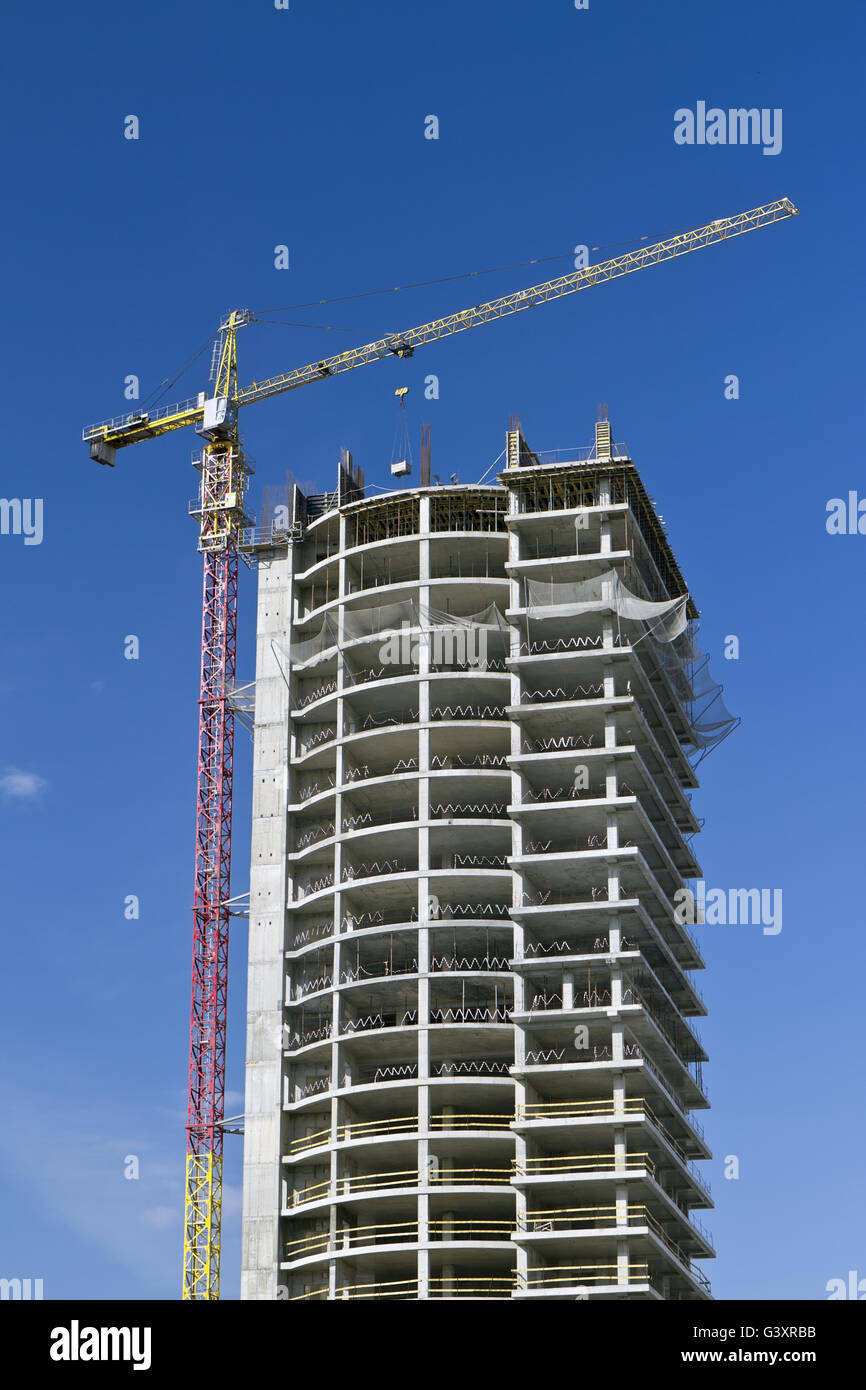 New building construction. Cranes on a construction site Stock Photo ...