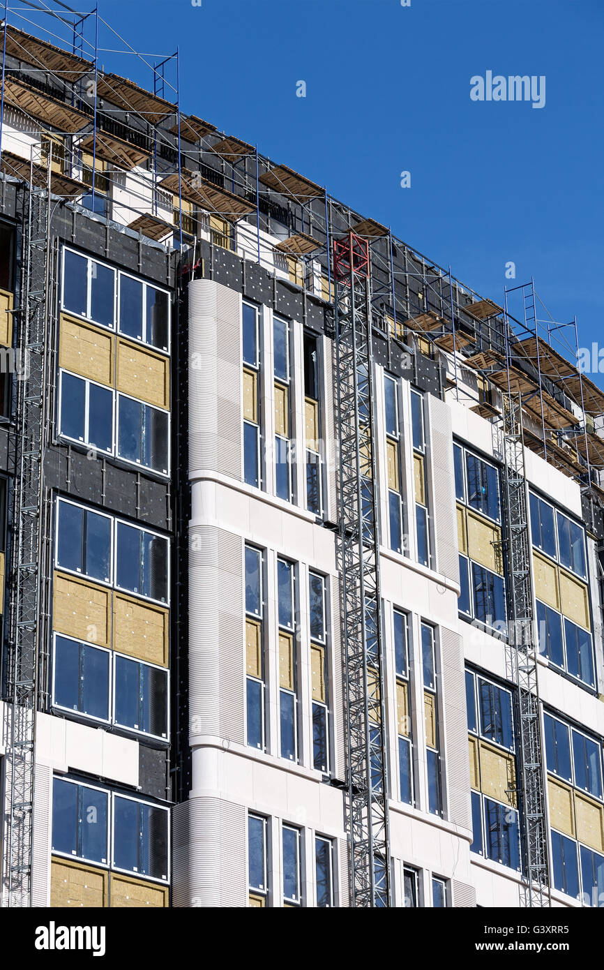 Incomplete modern building under construction with scaffolding Stock ...