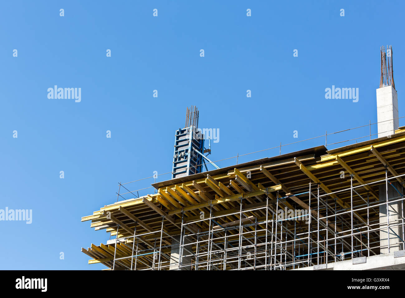 Concrete modern building under construction with scaffolding Stock ...