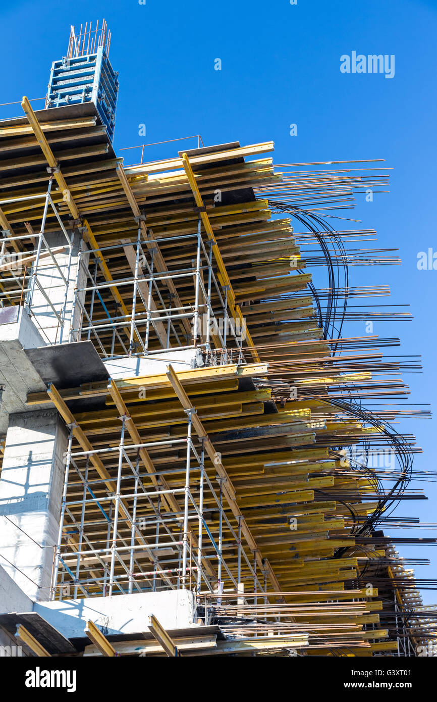Temporary scaffolding, beams and reinforcement steel at building site ...