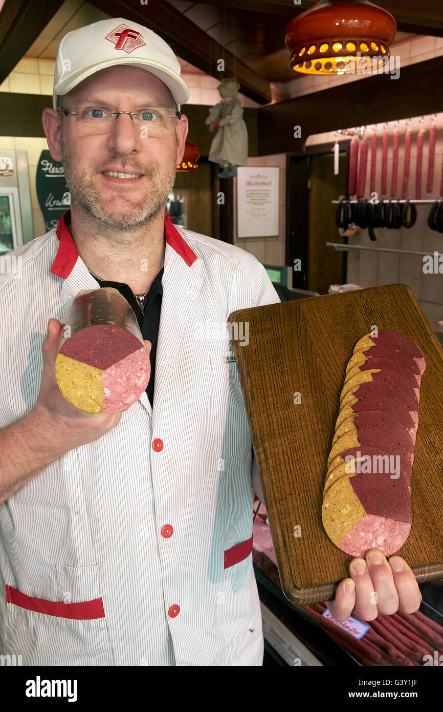 Butcher Markus Kramb shows his creative sausage in the German colours ...