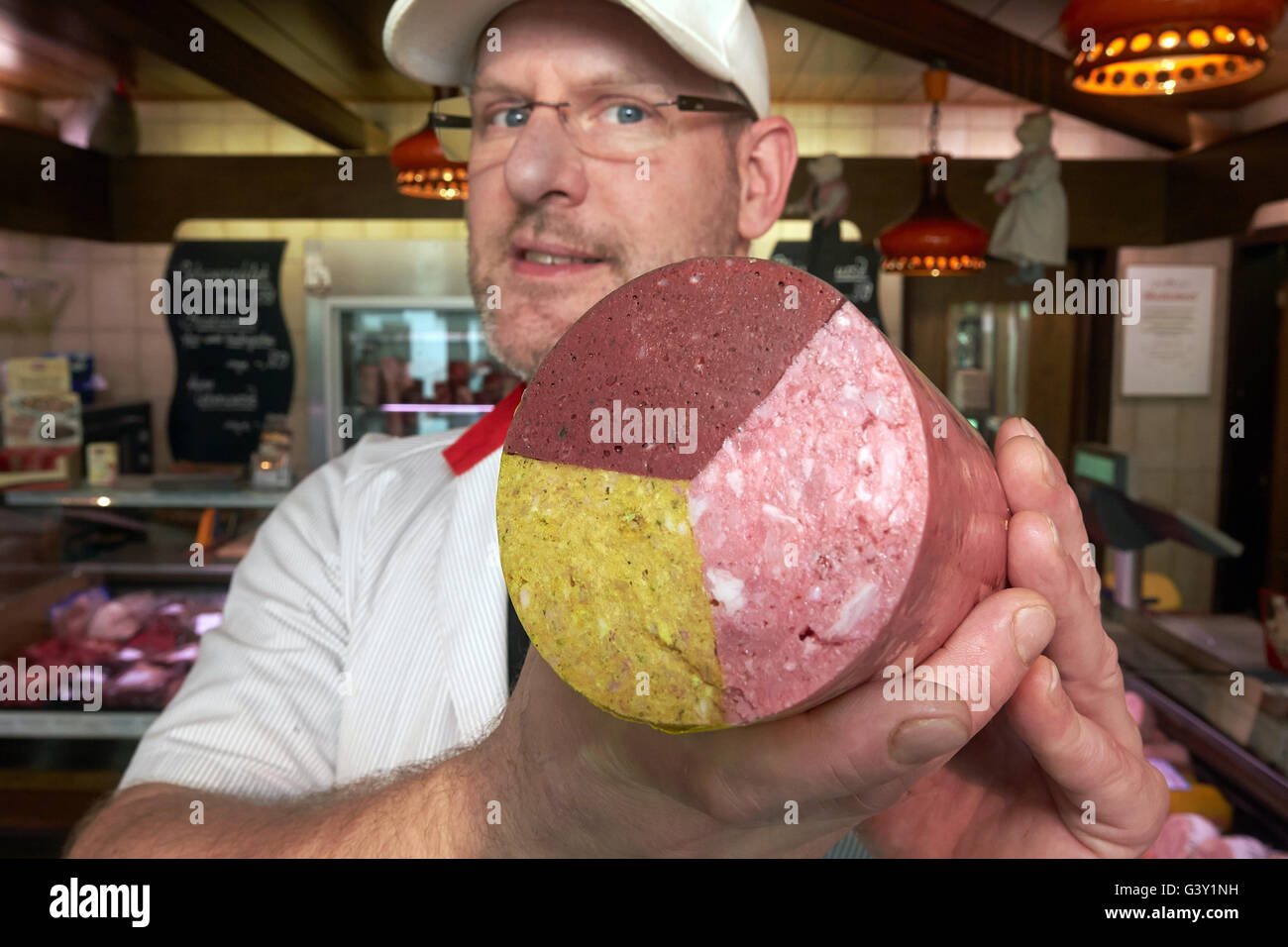 Butcher Markus Kramb shows his creative sausage in the German colours ...
