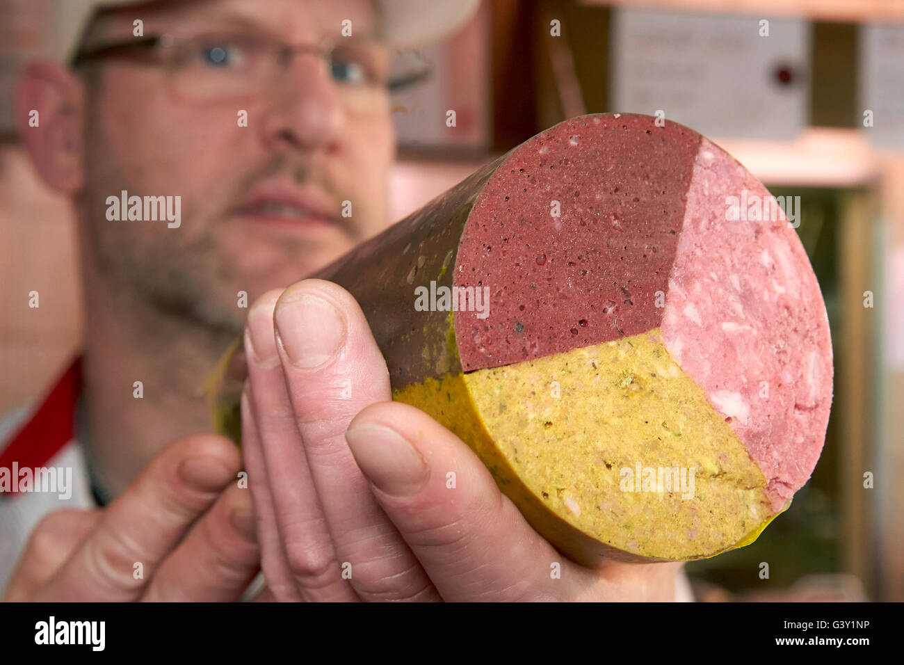 Butcher Markus Kramb shows his creative sausage in the German colours ...
