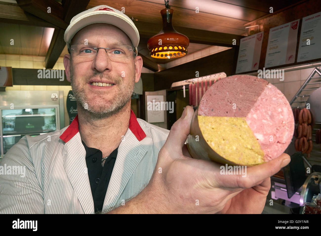 Butcher Markus Kramb shows his creative sausage in the German colours ...