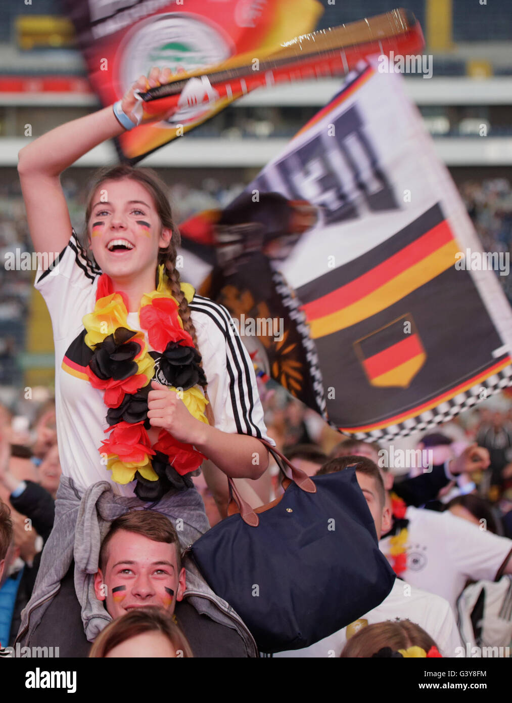 Thousands of fans watch the soccer match between Germany and Poland at ...