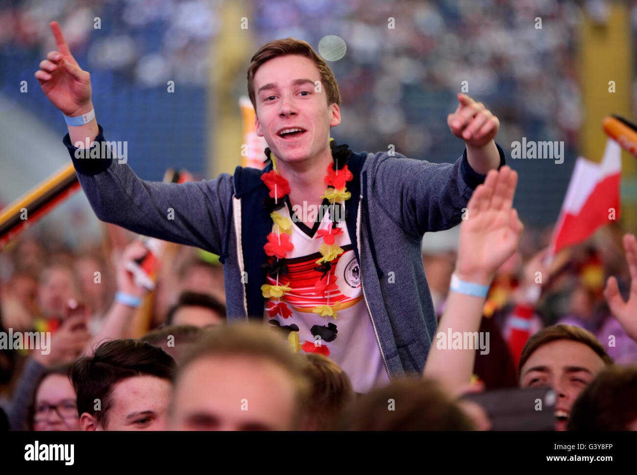 Thousands of fans watch the soccer match between Germany and Poland at ...