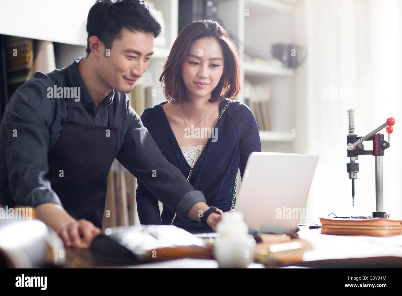 Cheerful craftsman using laptop in hi-res stock photography and images ...