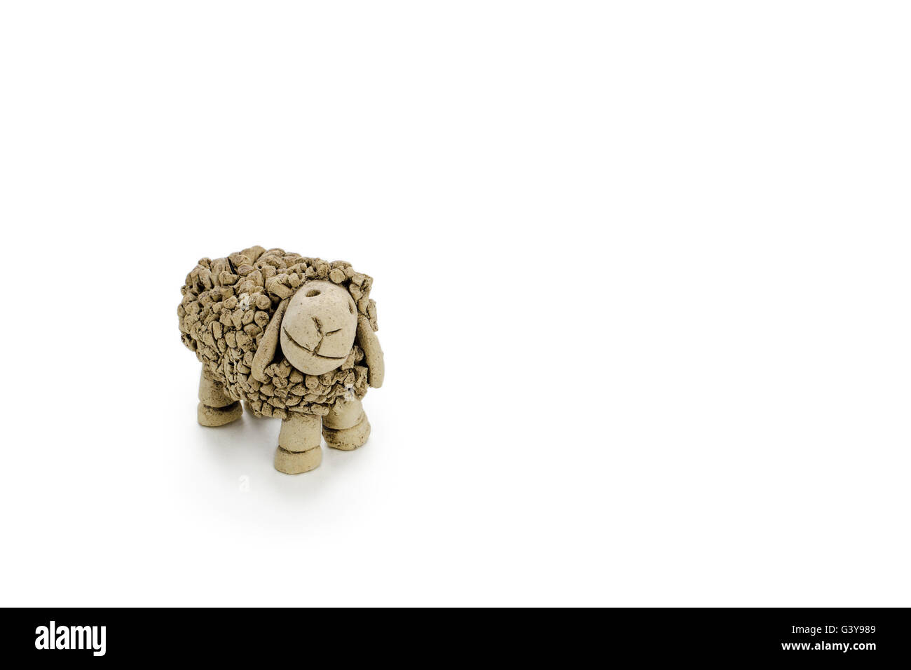 Sheep figure made of clay on a white background Stock Photo - Alamy