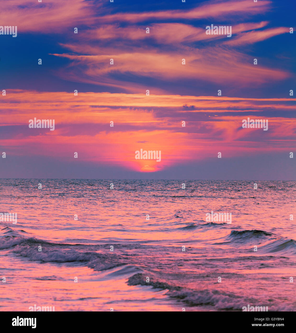 Sunset over sea with dramatic beautiful sky Stock Photo - Alamy
