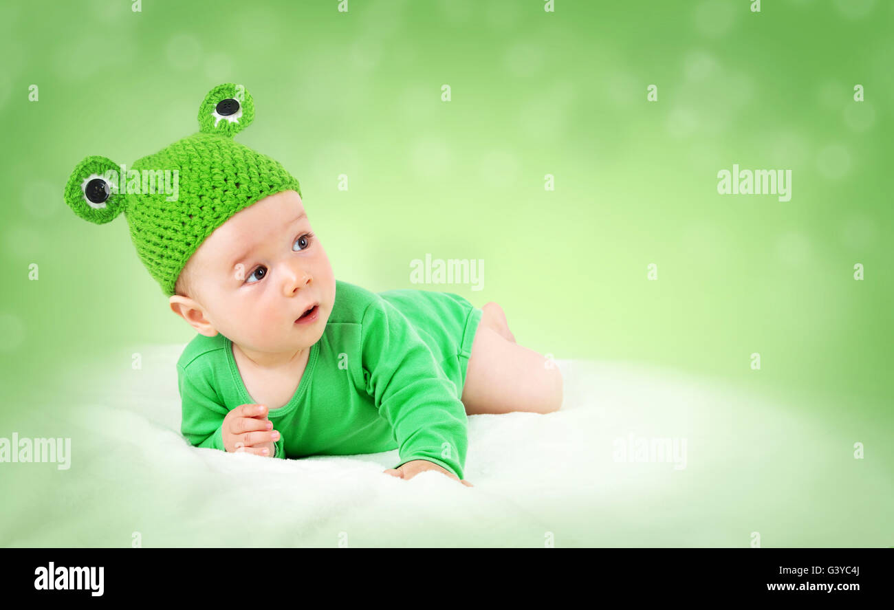 Baby in frog hat Stock Photo - Alamy