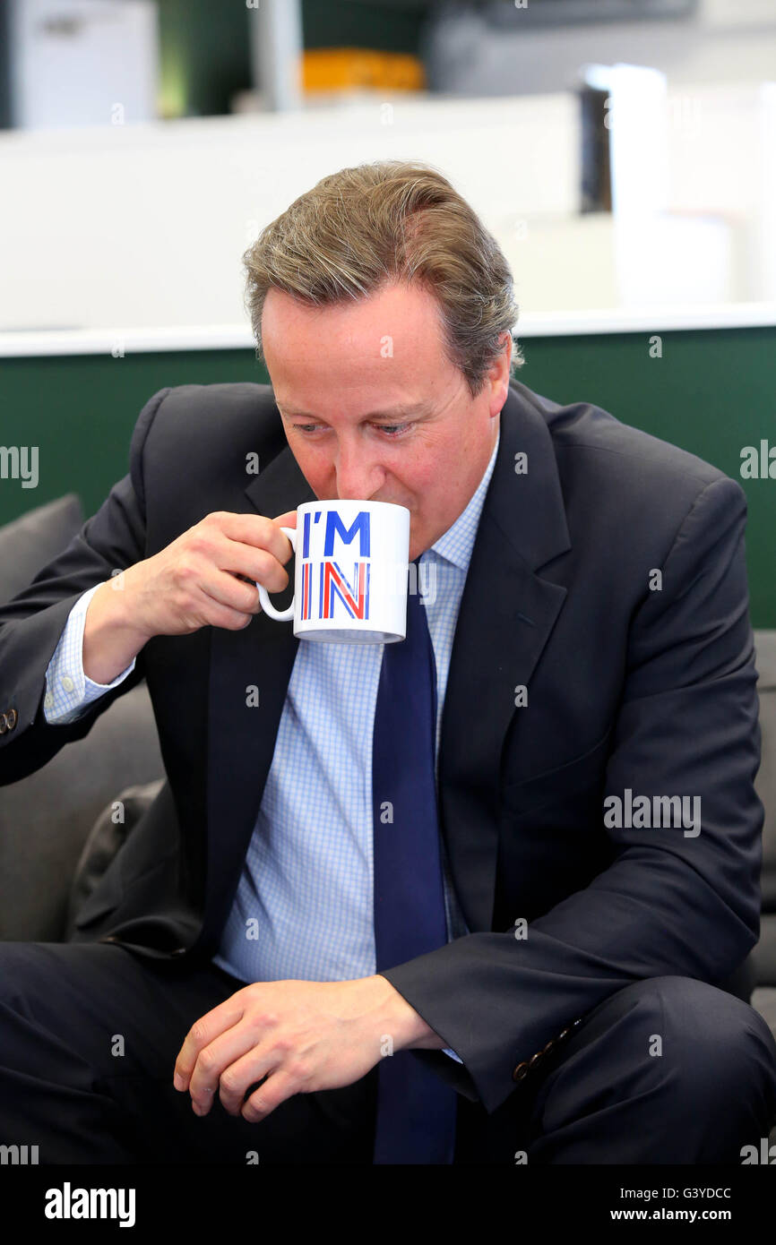 Prime Minister David Cameron sips from a mug as he met Jeremy Clarkson ...