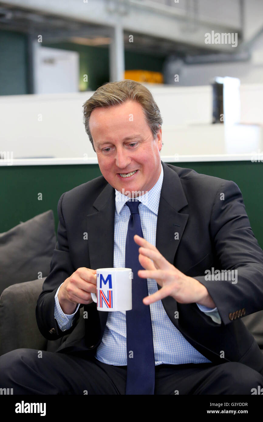 Prime Minister David Cameron holds a mug as he met Jeremy Clarkson and ...
