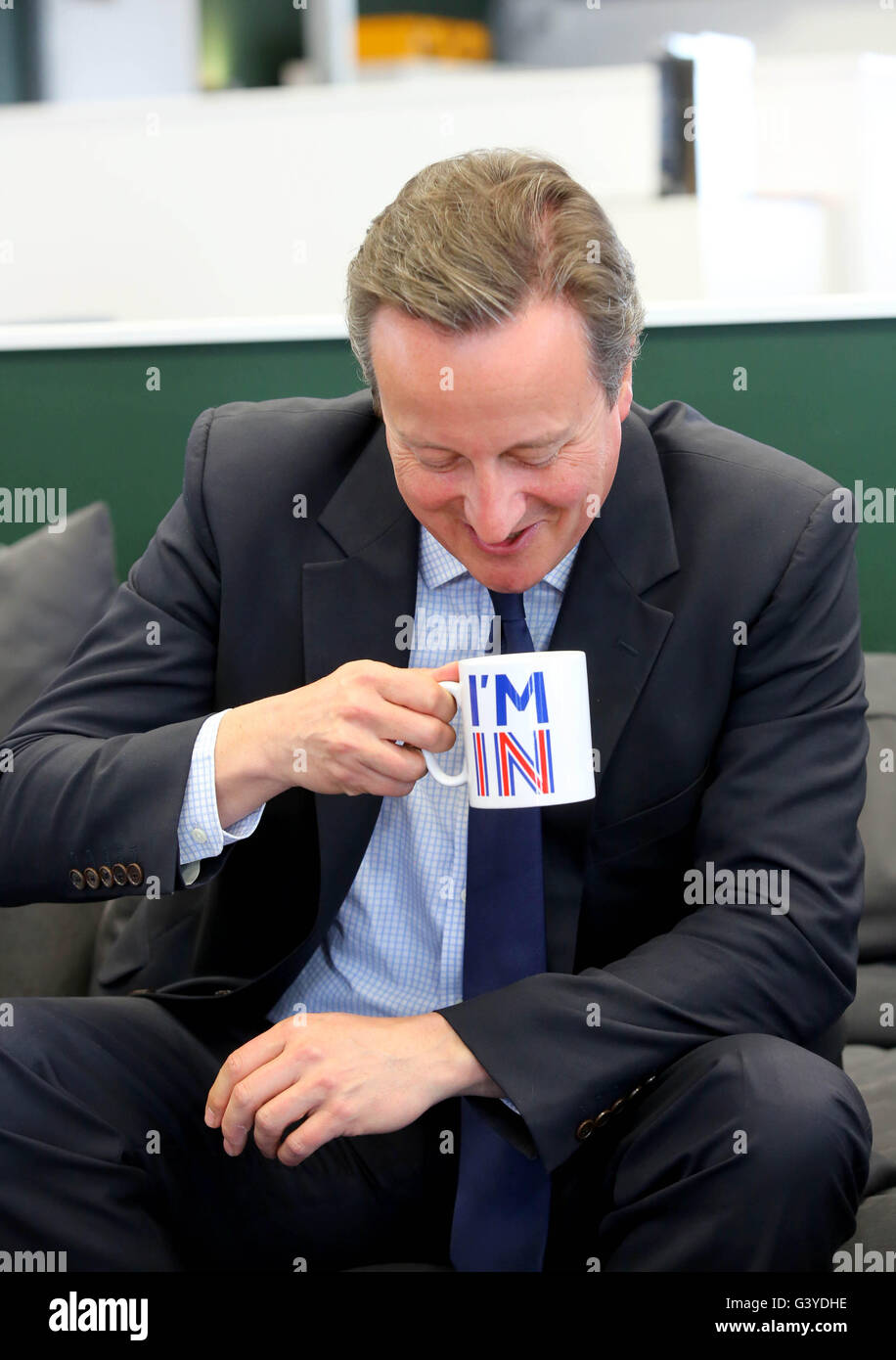 Prime Minister David Cameron holds a mug as he met Jeremy Clarkson and ...