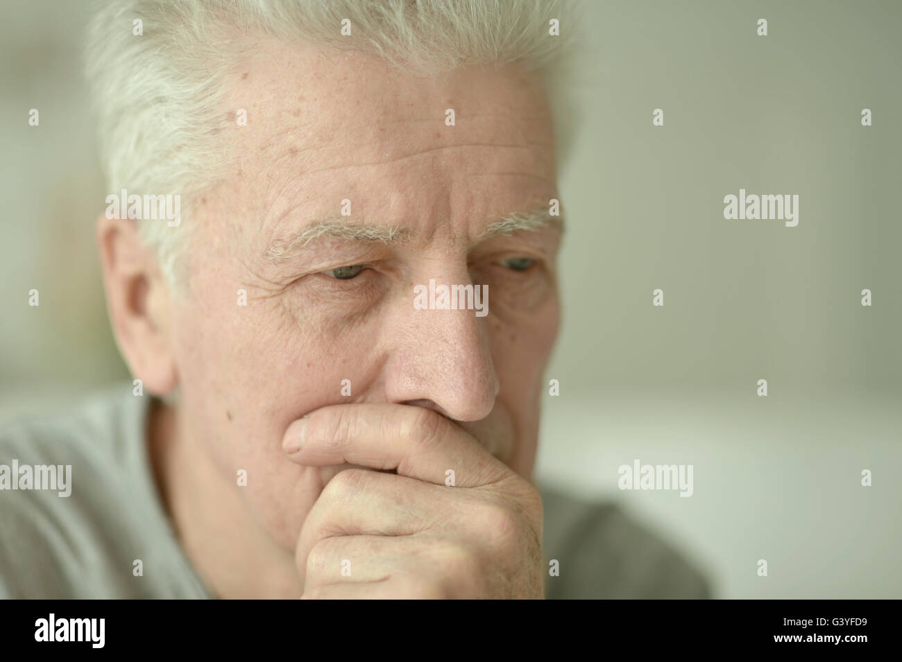 Sad senior man at home Stock Photo - Alamy