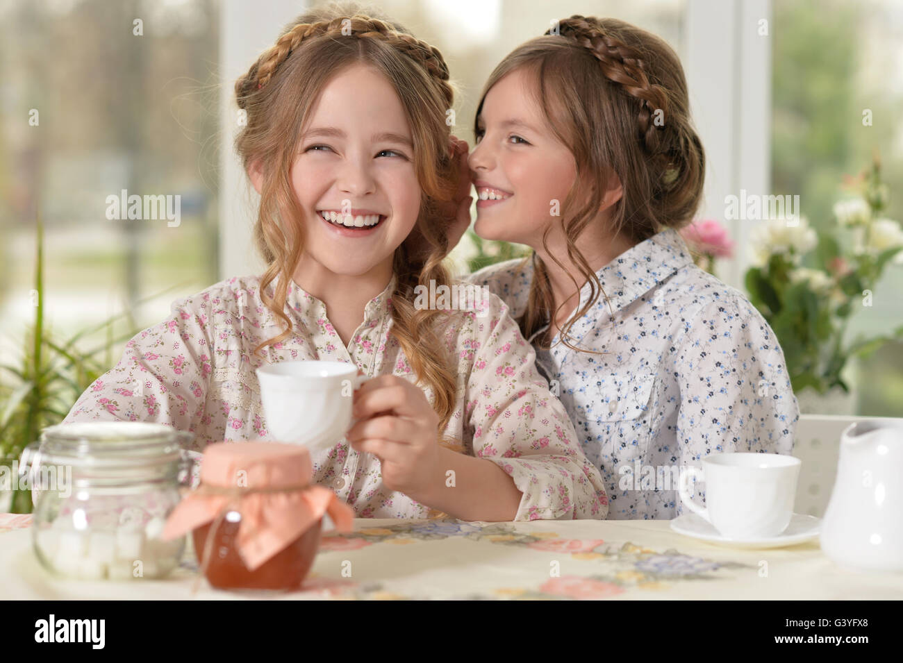 little girls drinking tea Stock Photo - Alamy