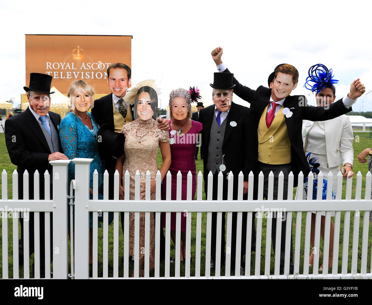 Racegoers wearing masks of the Royal family during day three of Royal ...