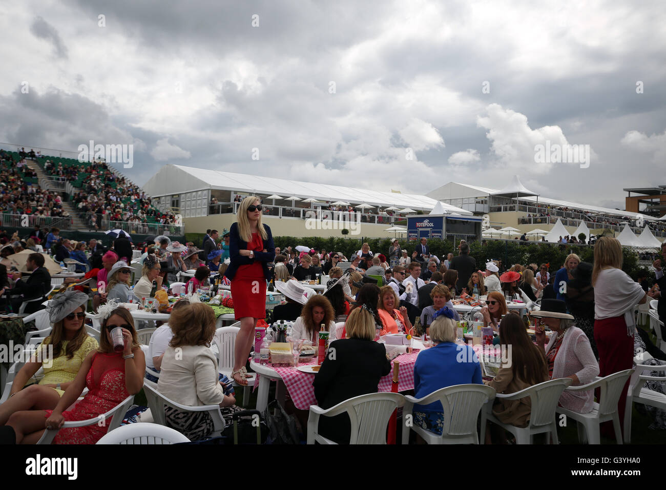 A racegoer stands on a chair for a better view during day three of ...