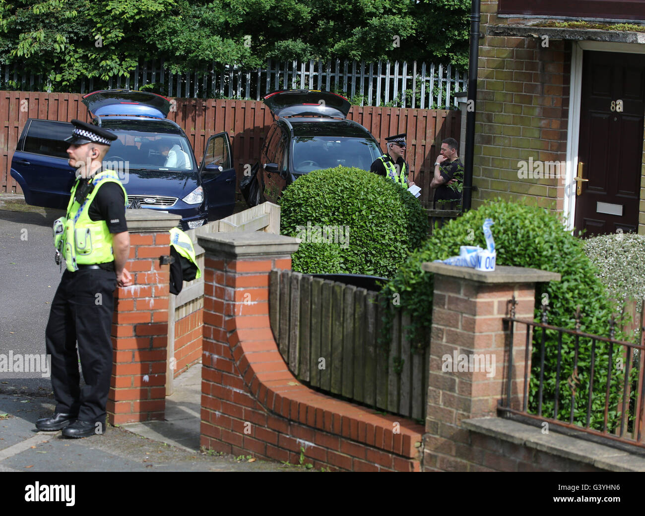 Police search a vehicle outside a property in Lowood Lane where Tommy ...