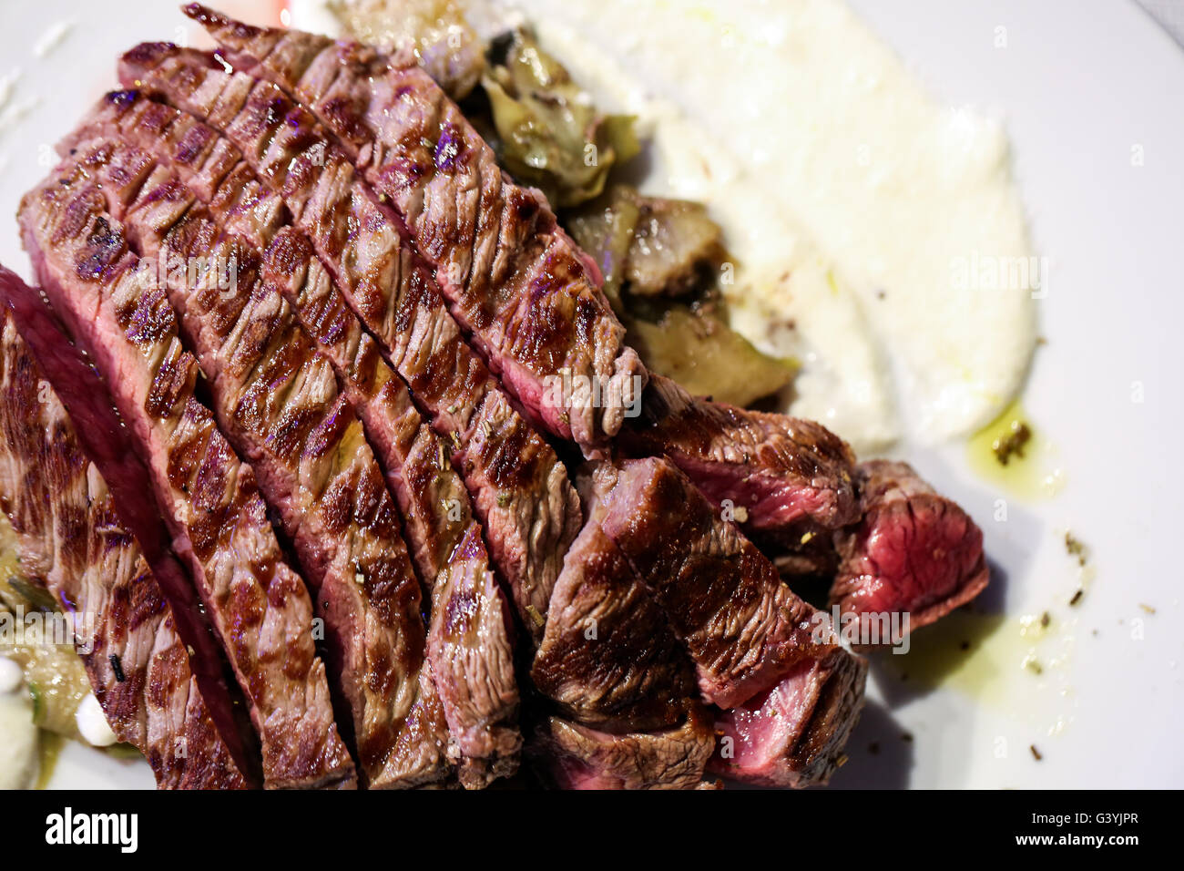 Cut meat in a dish, italian recipe Stock Photo - Alamy