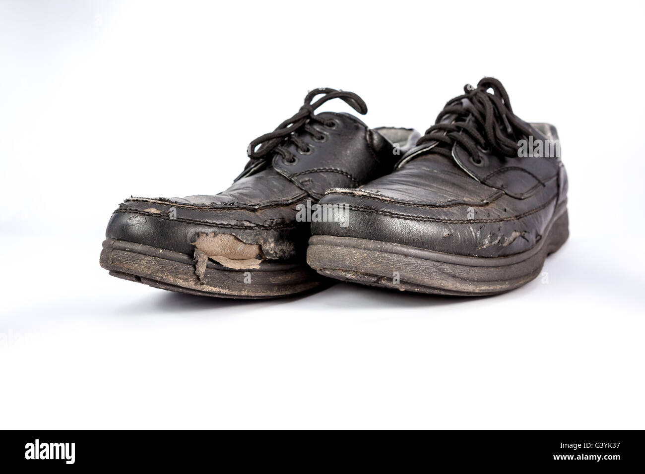 worn old shoes with an white background Stock Photo - Alamy