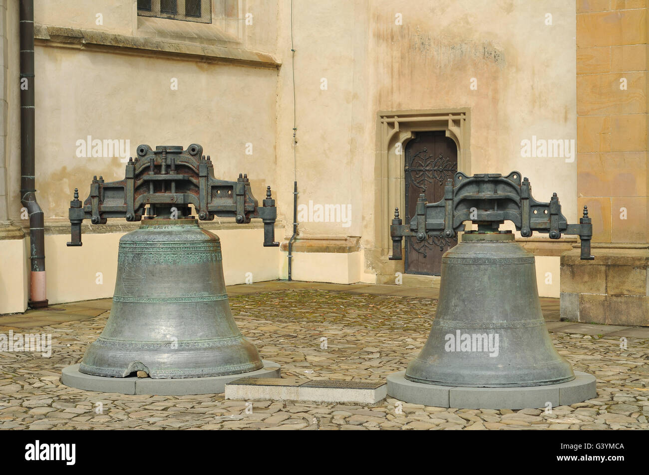 Bells in front of church Stock Photo - Alamy