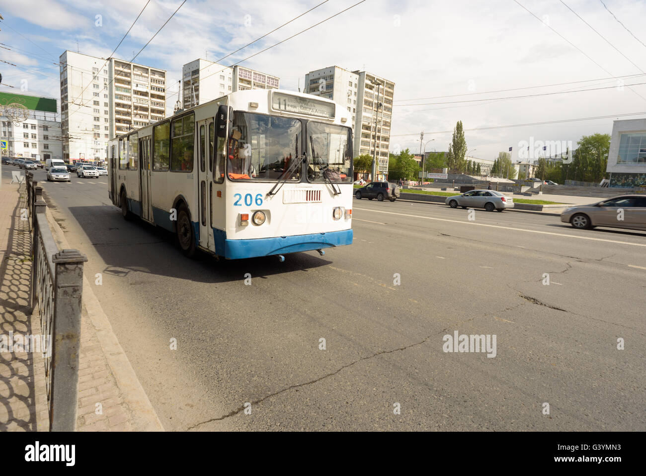 White and blue Russian Trolley Bus in Yekaterinburg carrying people to ...