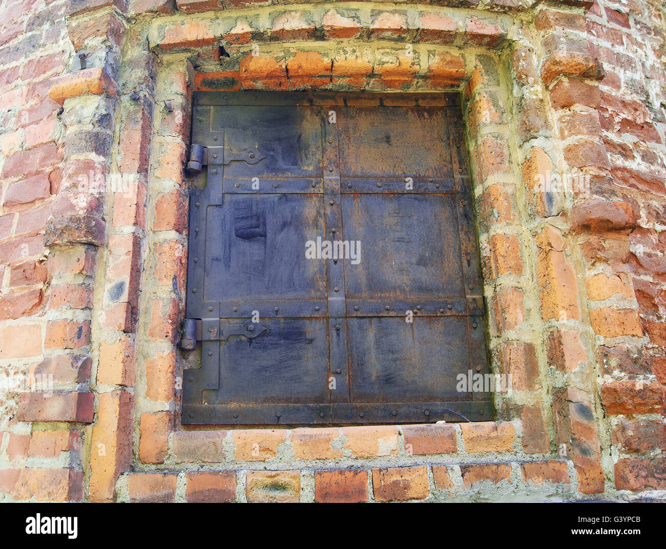 The shutters close the window in a brick wall Stock Photo - Alamy