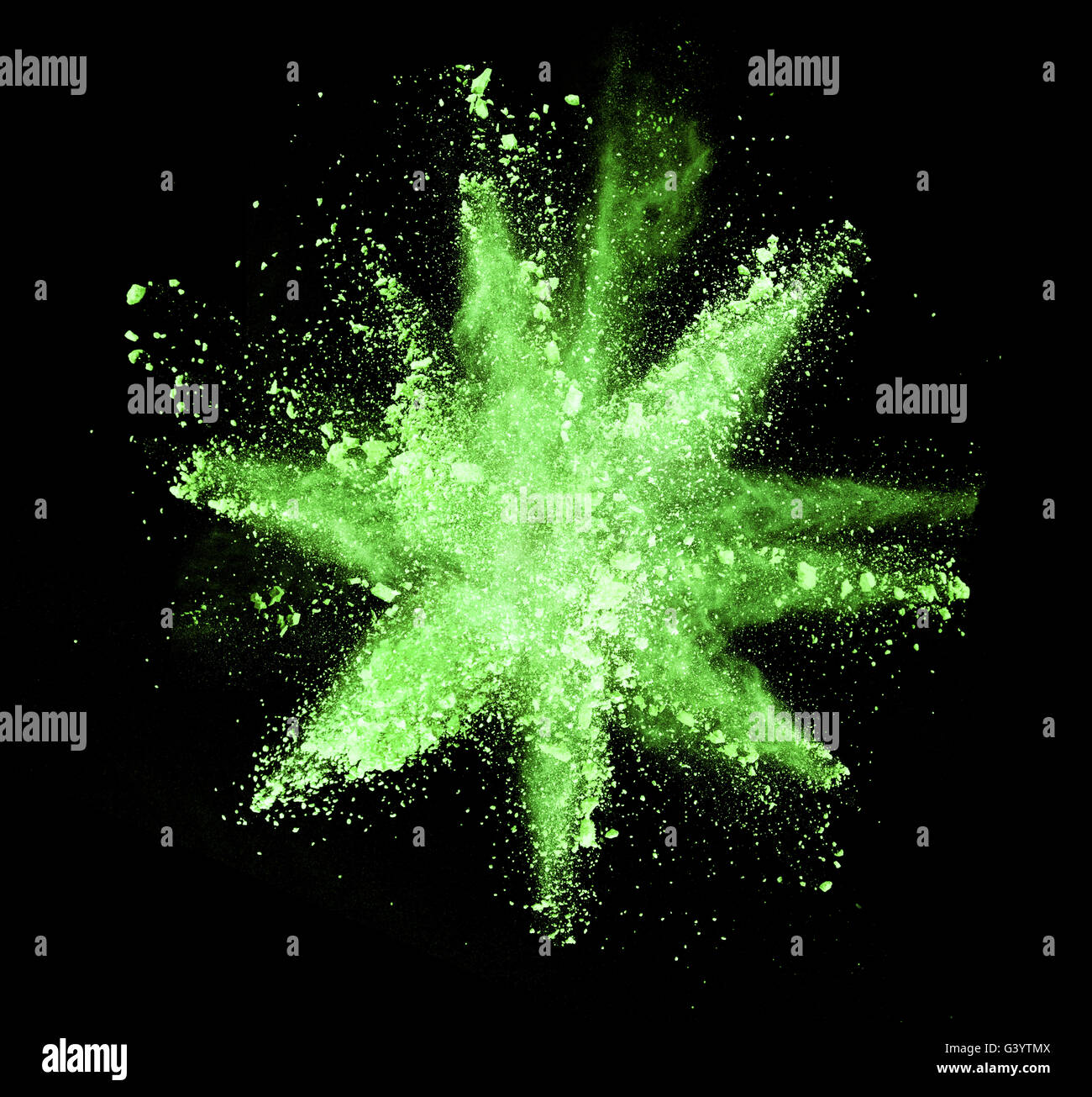 Explosion of green powder, isolated on black background Stock Photo - Alamy