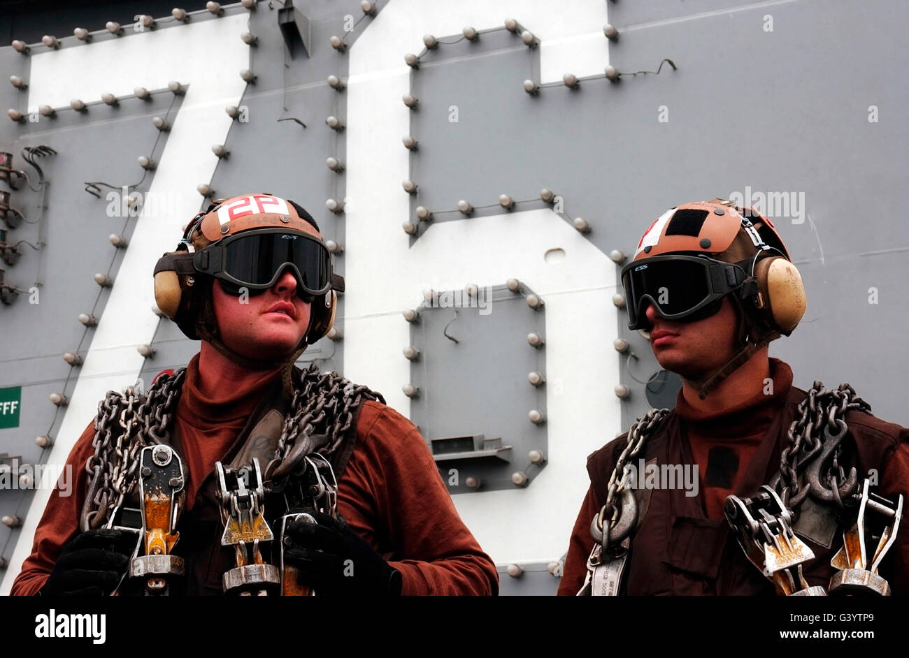 Captains observe flight operations in front of the ship's island on USS ...