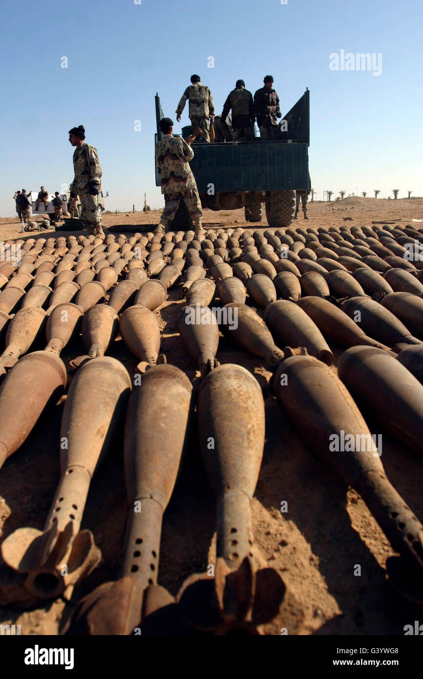 Soldiers load 120 millimeter white phosphorous mortar rounds onto an ...