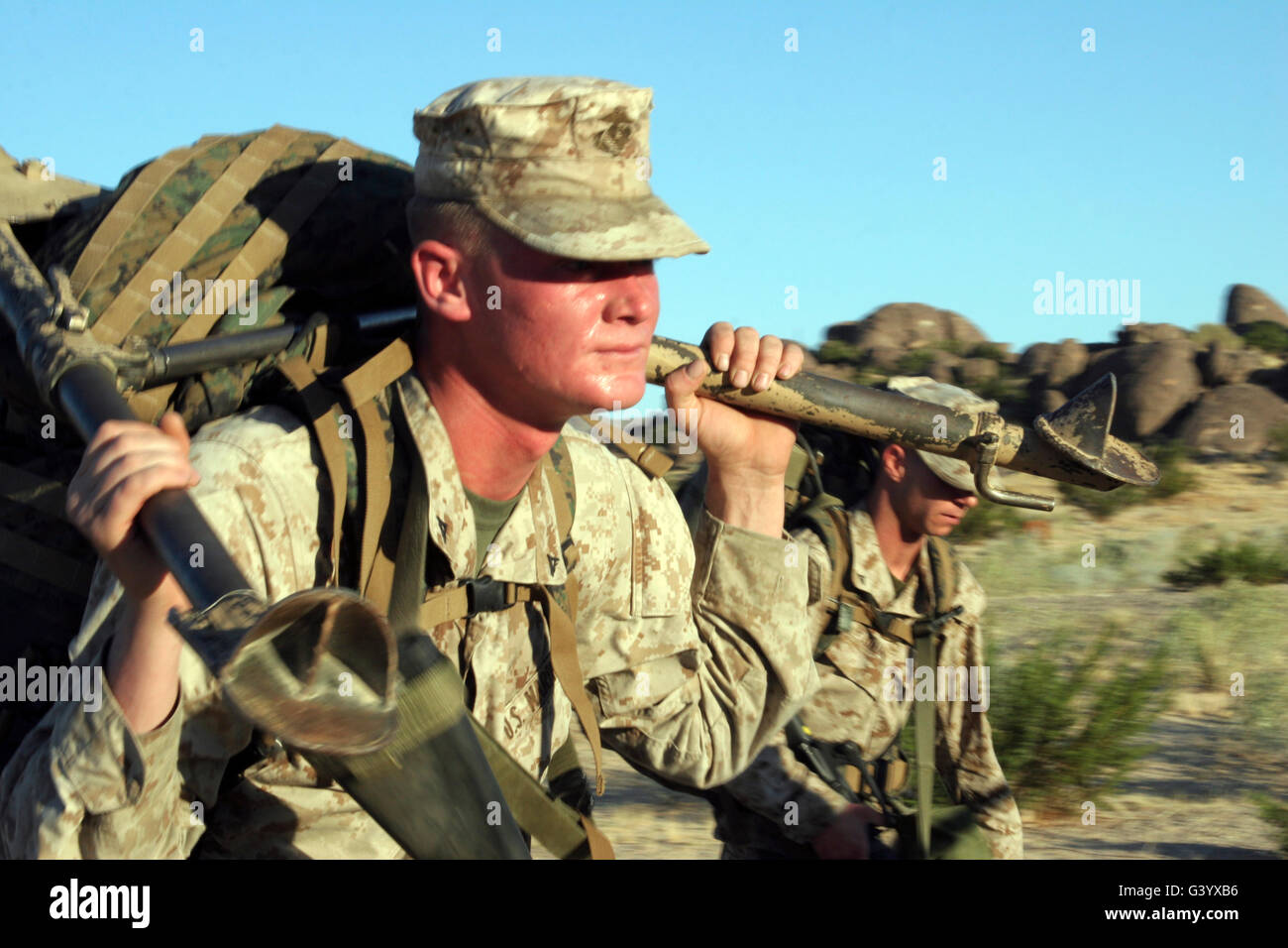 A Marine carries a 44-pound M2 .50 caliber machine gun tripod Stock ...
