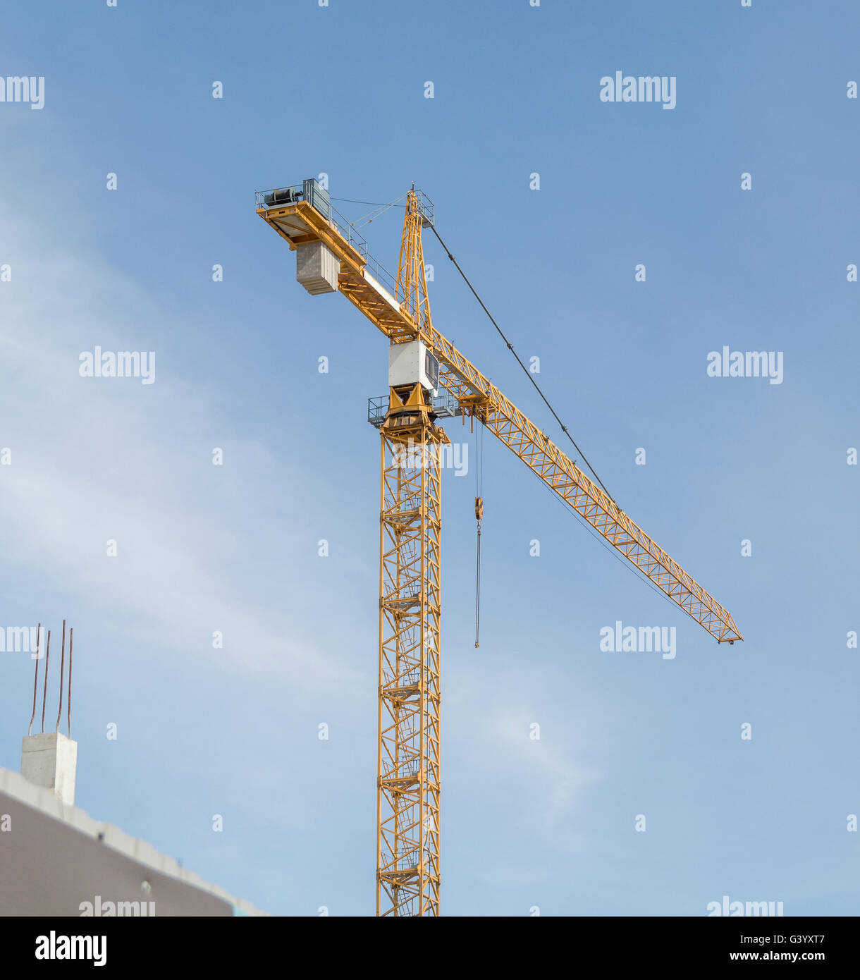 Big construction crane and the building against the sky background ...