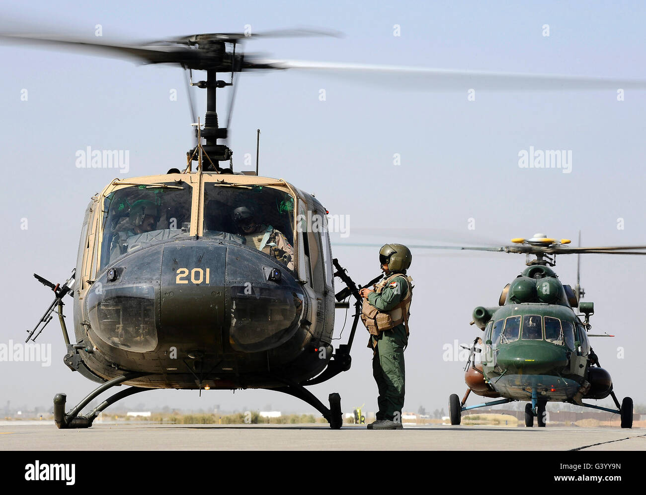An Iraqi UH-1H Iroquois helicopter and an Iraqi Mi-17 Hip helicopter ...