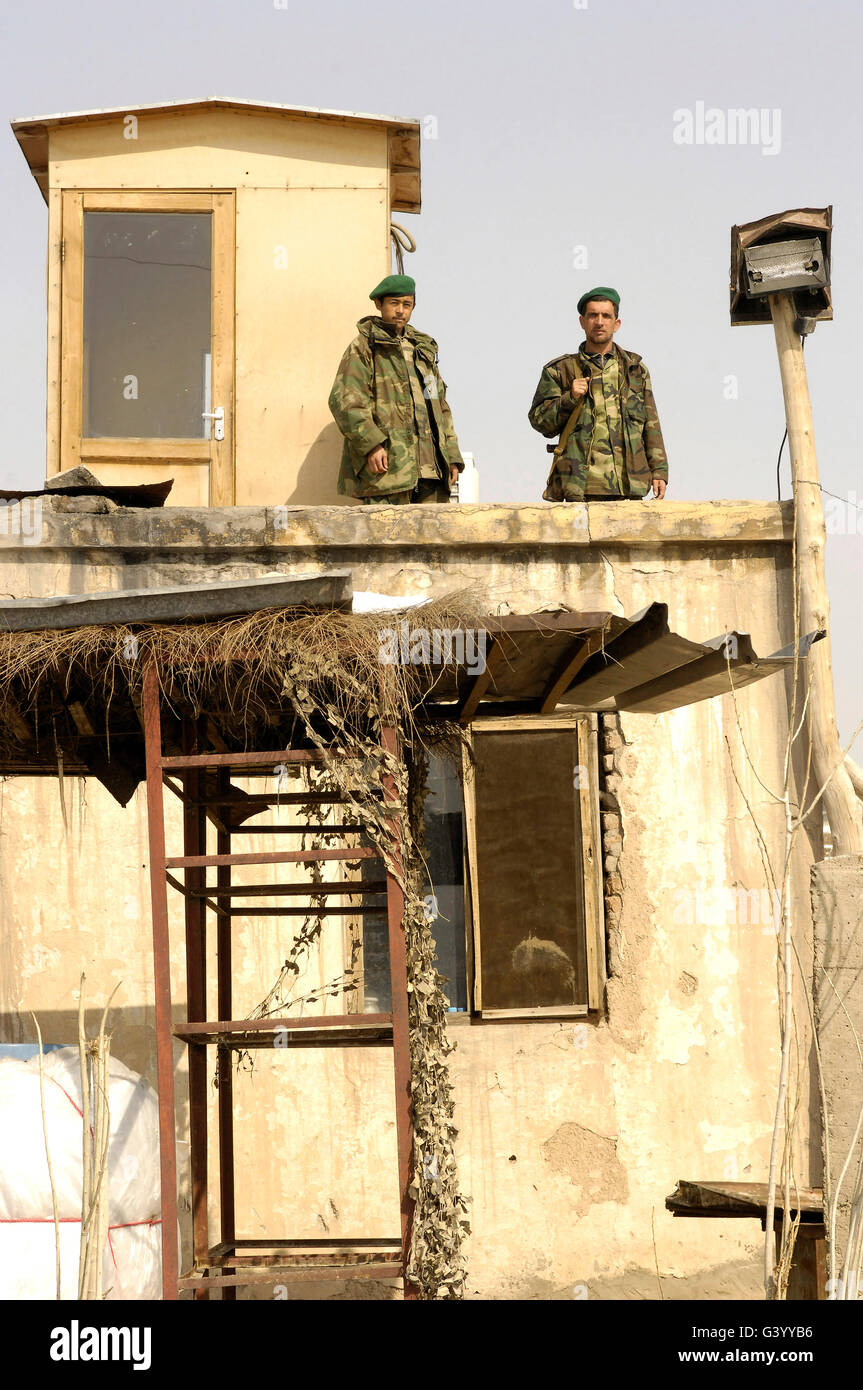 Afghanistan National Army soldiers stand atop a security tower Stock ...