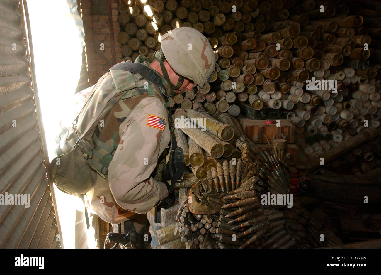 A U.S. Army soldier entering a weapons cache site in Jalalabad ...