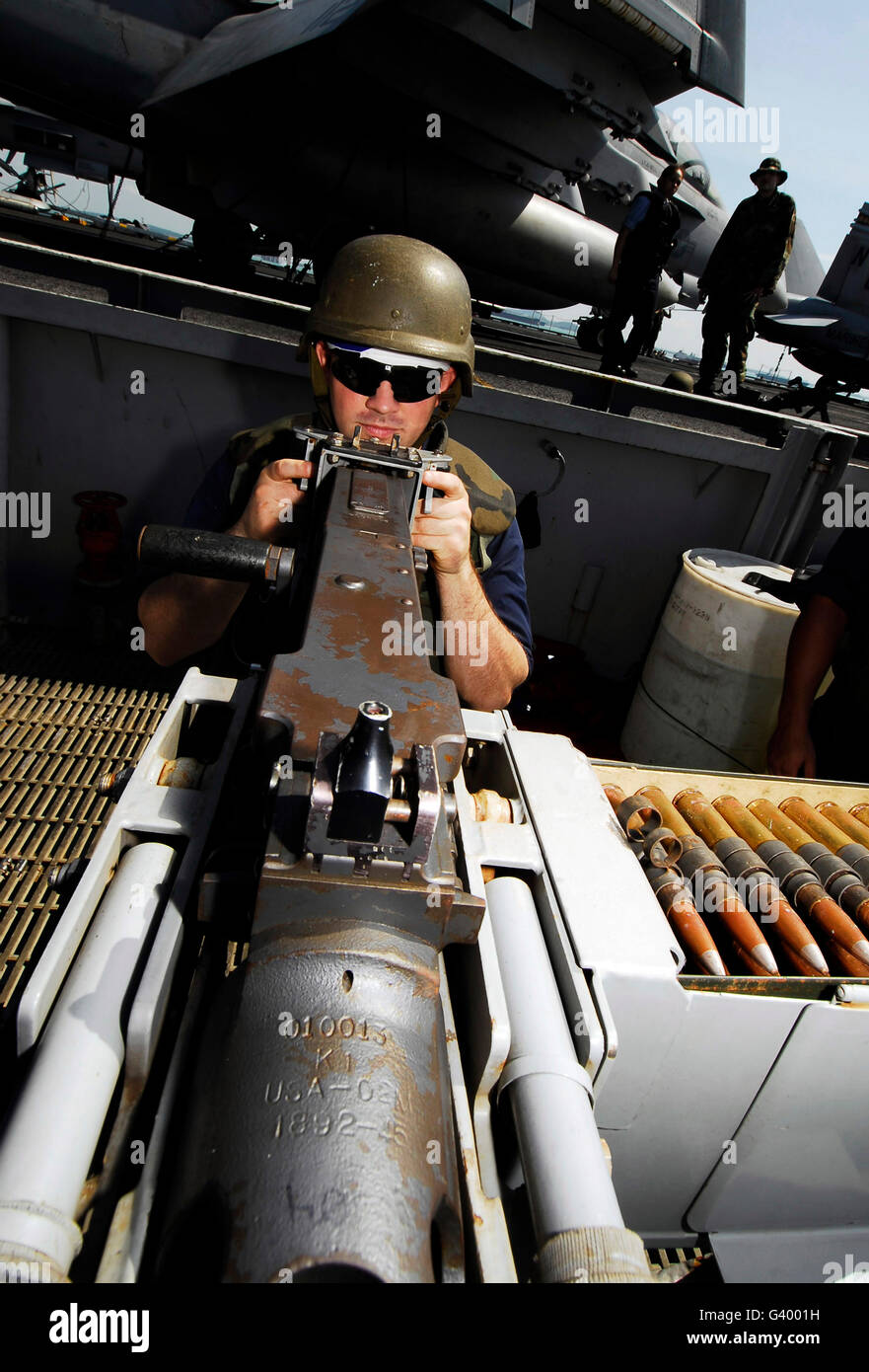 Gunner's Mate stands a .50-caliber machine gun force protection watch ...