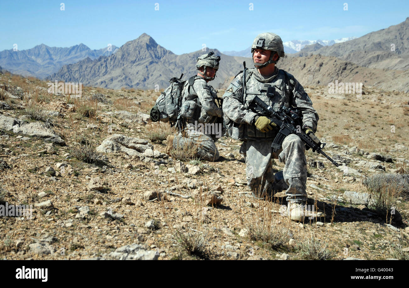 Army soldier holding safety helmet mountain uniform hi-res stock ...