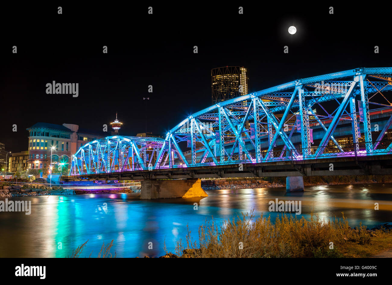 Full moon over Langevin Bridge at night in downtown Calgary. The truss ...