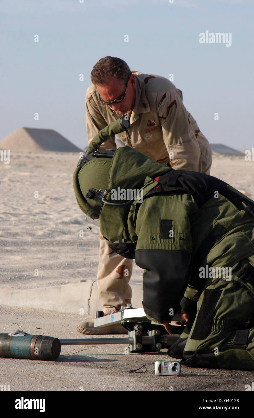 Navy Explosive Ordnance Disposal Mobile Unit members rendering safe an ...