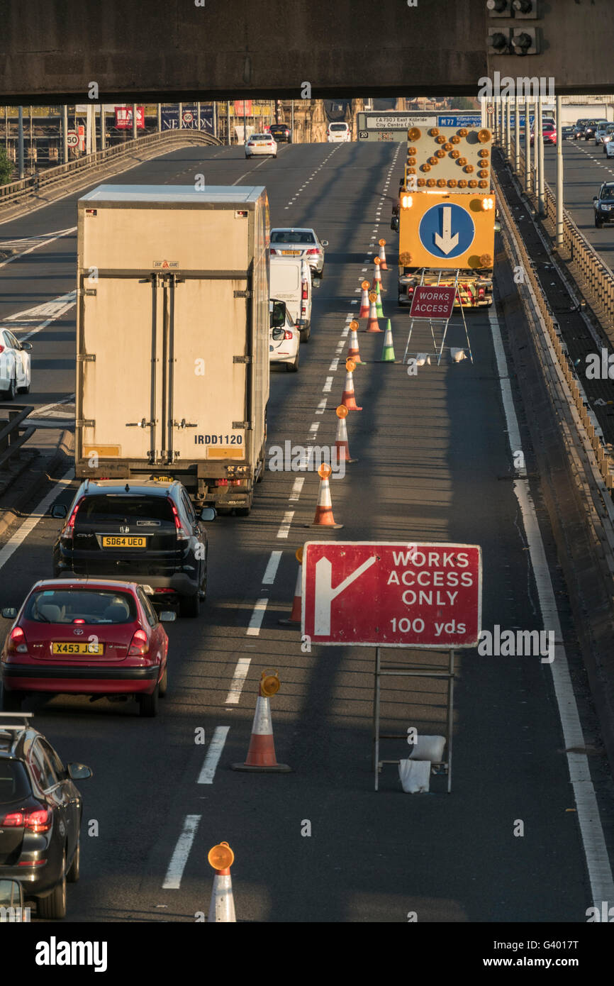 Traffic cones and road signs for lane closure on urban motorway,Glasgow ...
