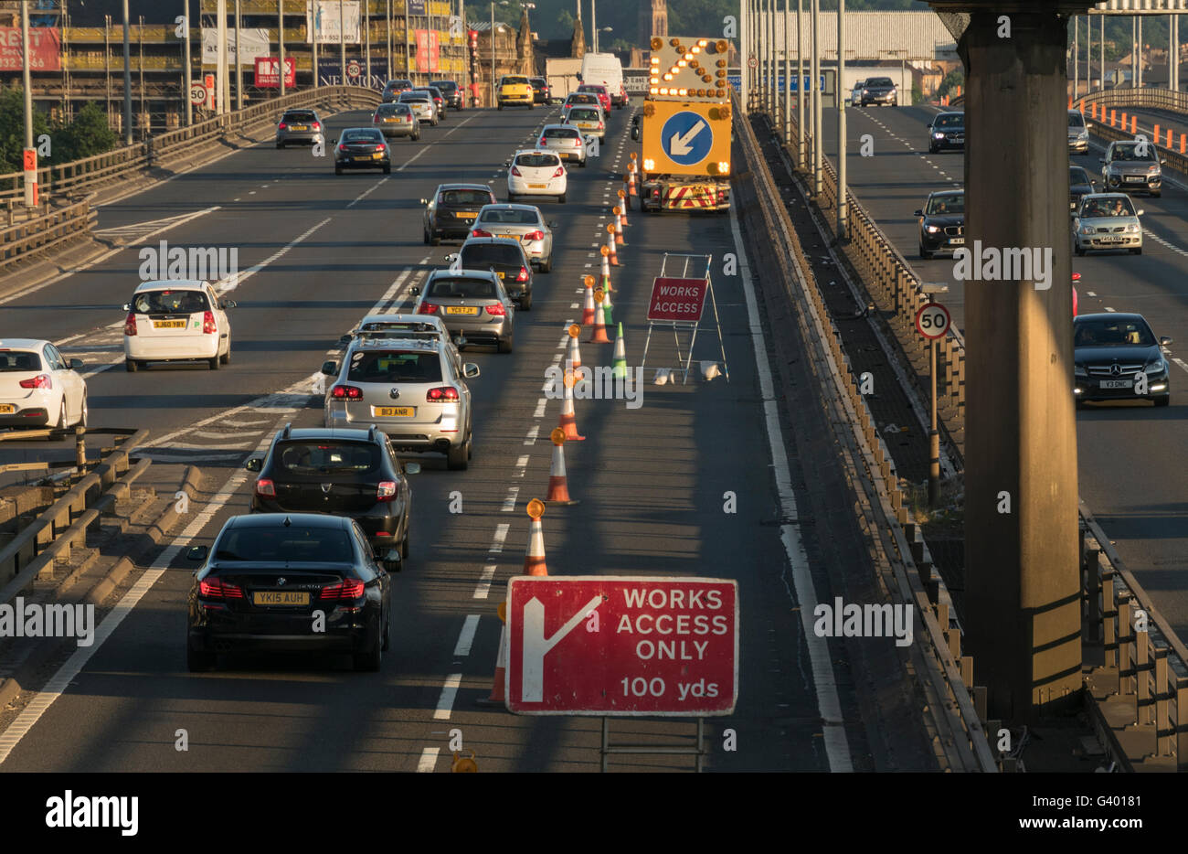 Traffic cones and road signs for lane closure on urban motorway,Glasgow ...