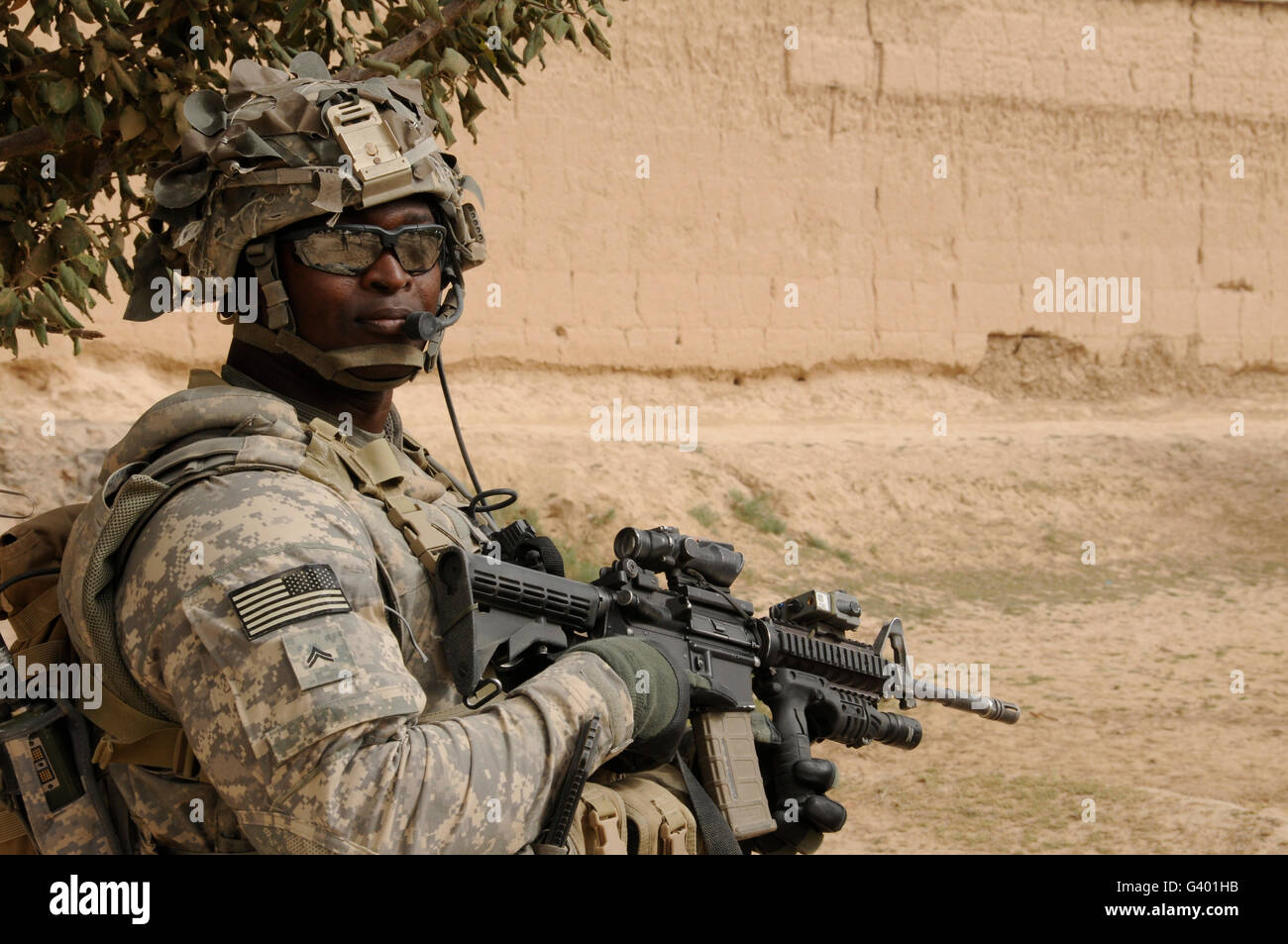 U.S. Army soldier scans his area while on patrol in Afghanistan Stock ...