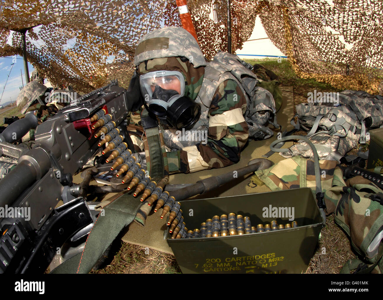 An Airman defends her position firing a M-240B machine gun Stock Photo ...