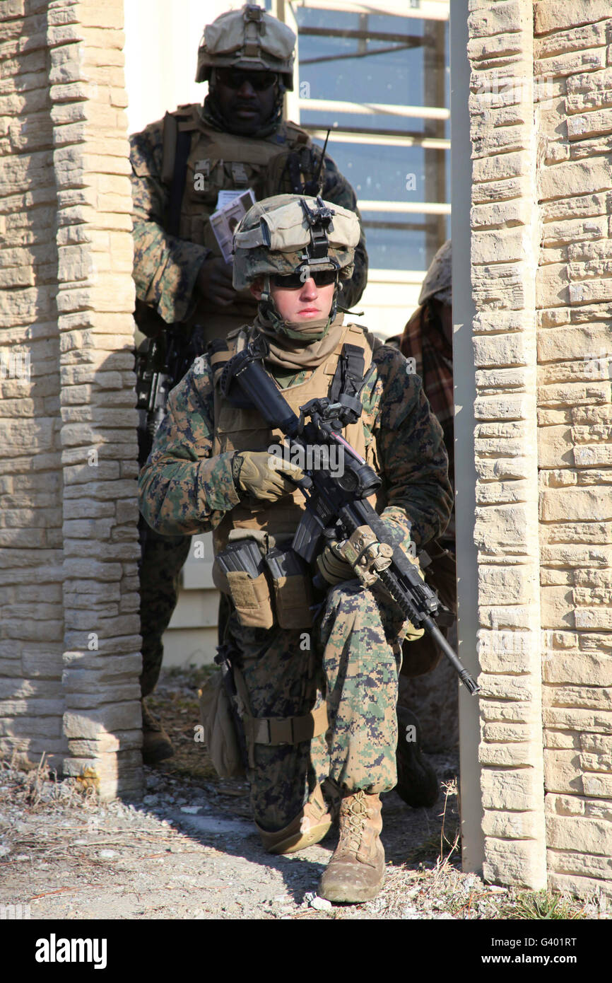 A U.S. Marine provides security while on patrol Stock Photo - Alamy