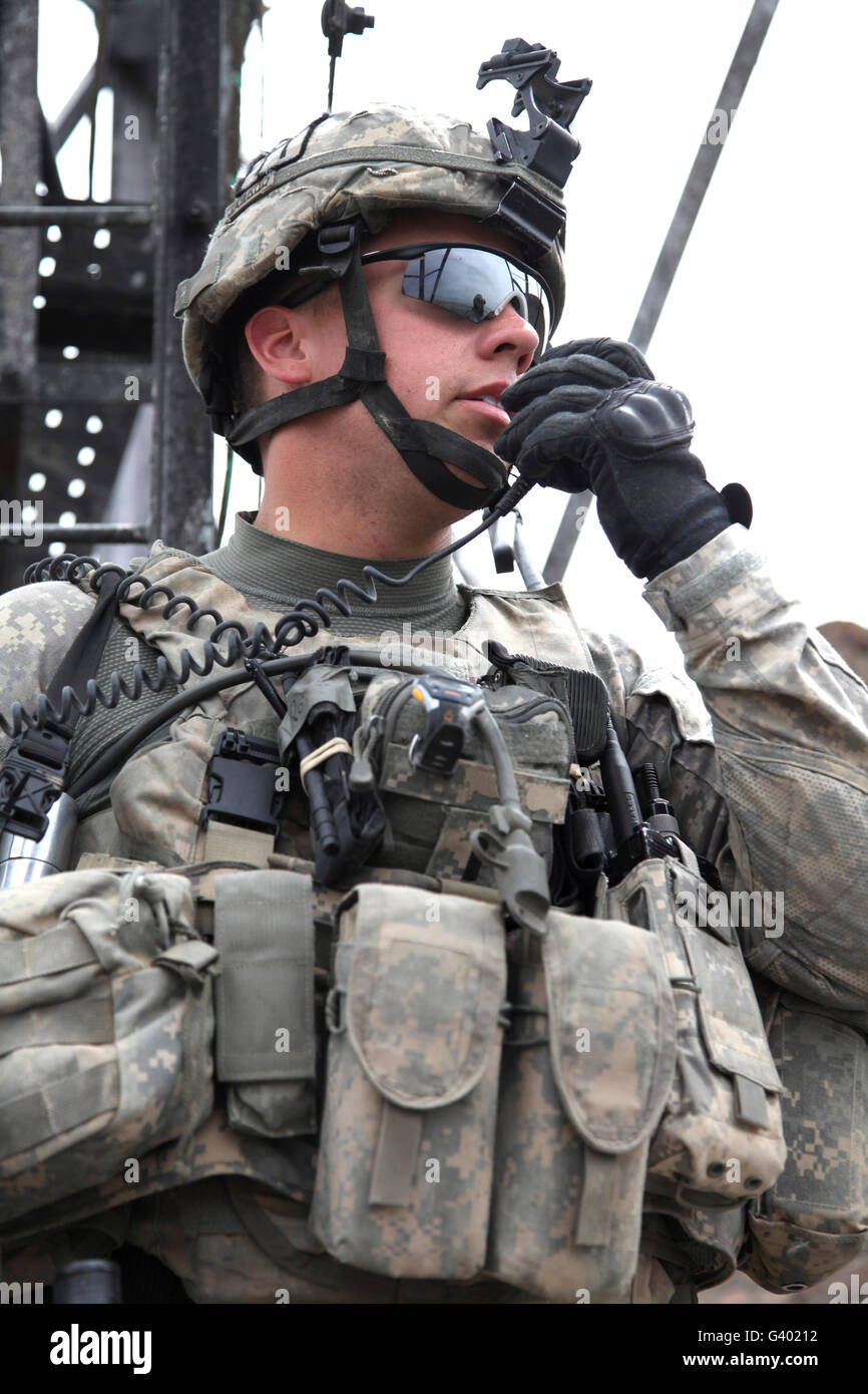 U.S. Army soldier communicates with his platoon during a patrol in ...
