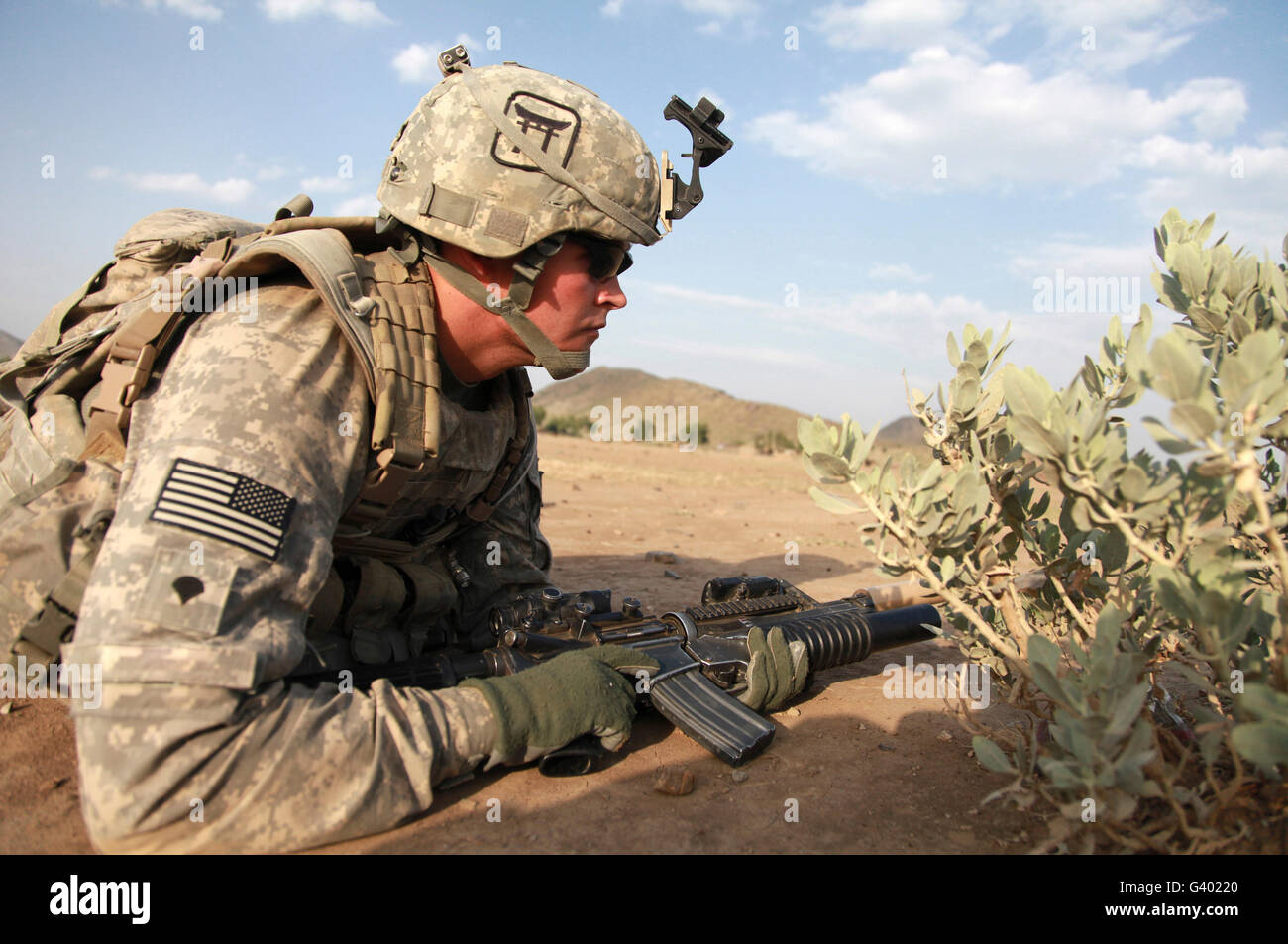 U.S Army Specialist provides security while on patrol in Afghanistan ...