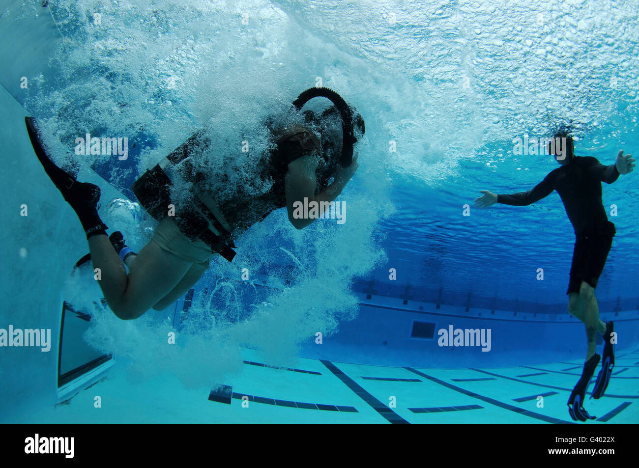 BUD/S students participate in underwater night gear exchange during the ...