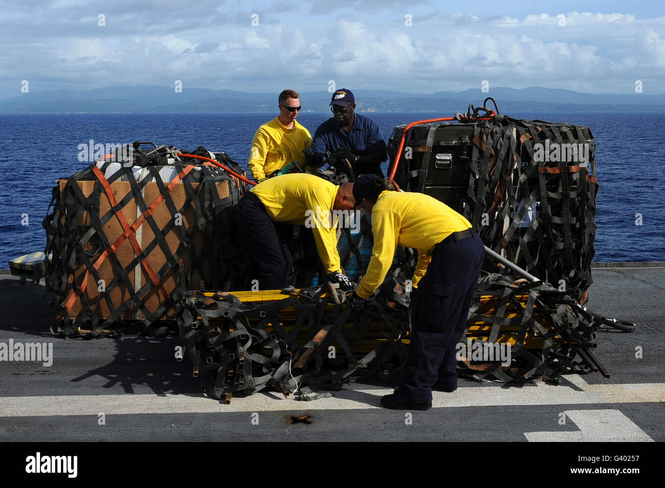 Sailors prepare pallets of cargo aboard hosptial ship USNS Comfort ...