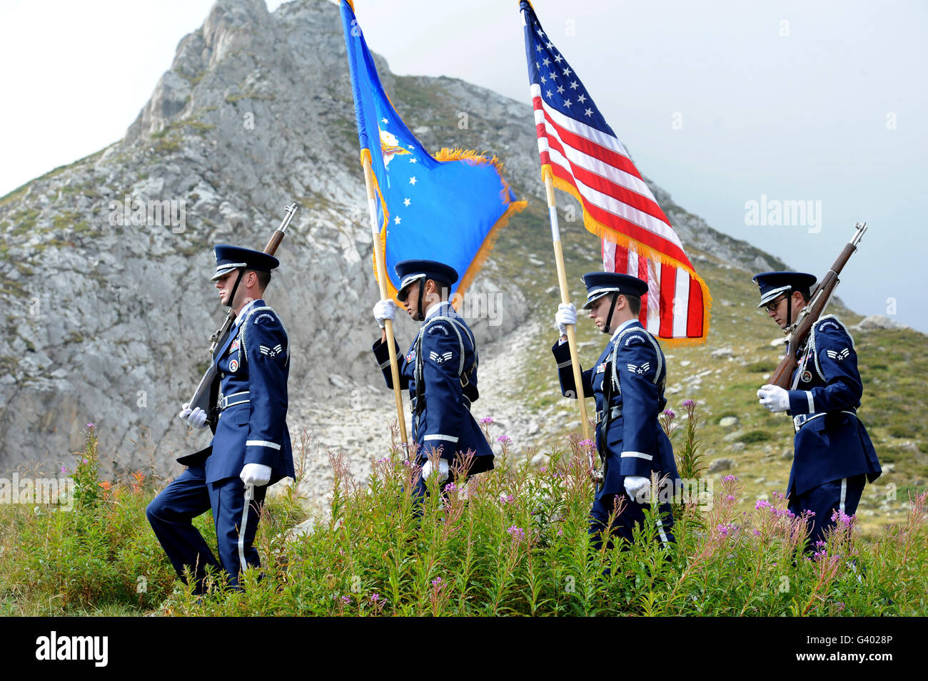 The Honor guard posts the colors before a ceremony at the base of ...